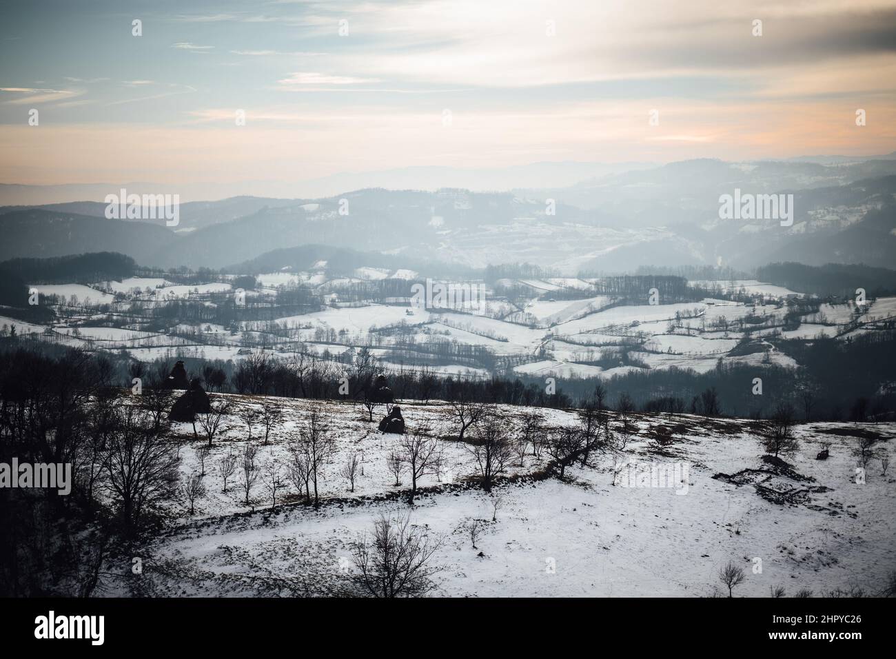 Foggy shot of a landscape under the cloudy skies on a cold day Stock ...
