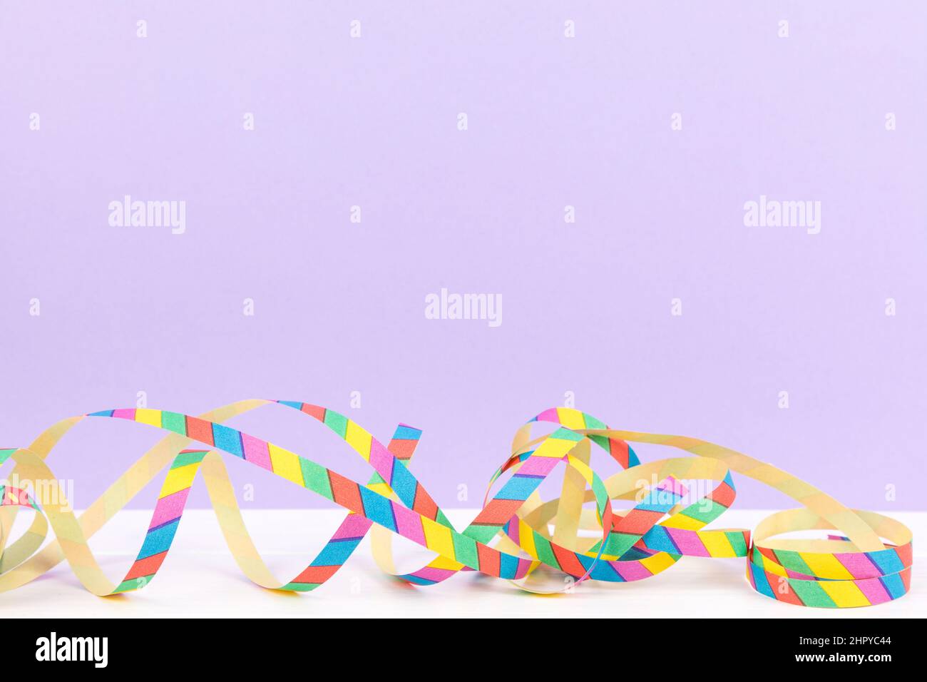 Closeup shot of a streamer frame on the purple background Stock Photo ...