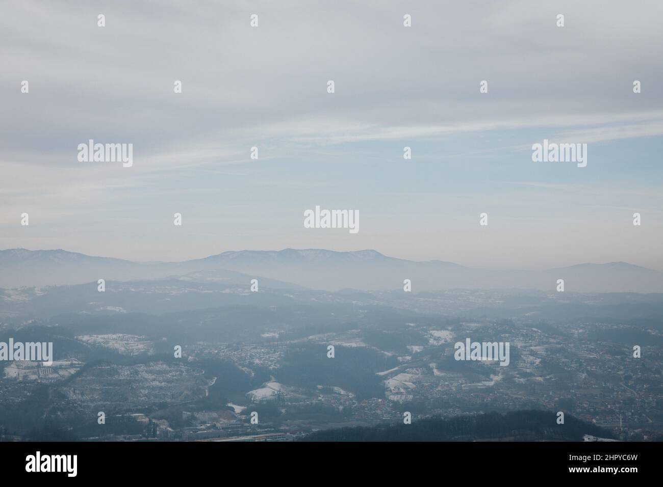 Foggy shot of a landscape under the cloudy skies on a cold day Stock ...