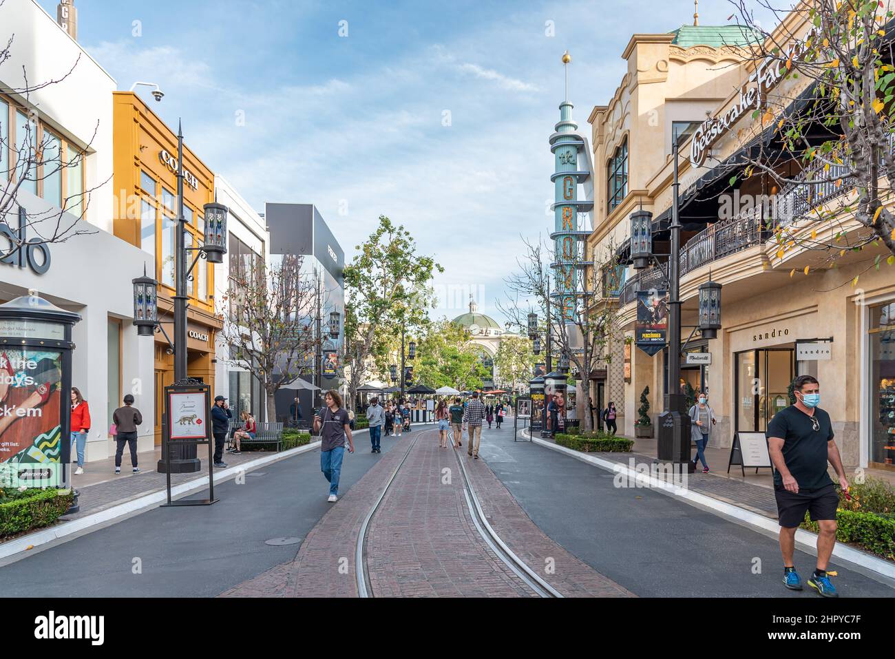 Street view of The Grove in Los Angeles, California, and people wearing ...