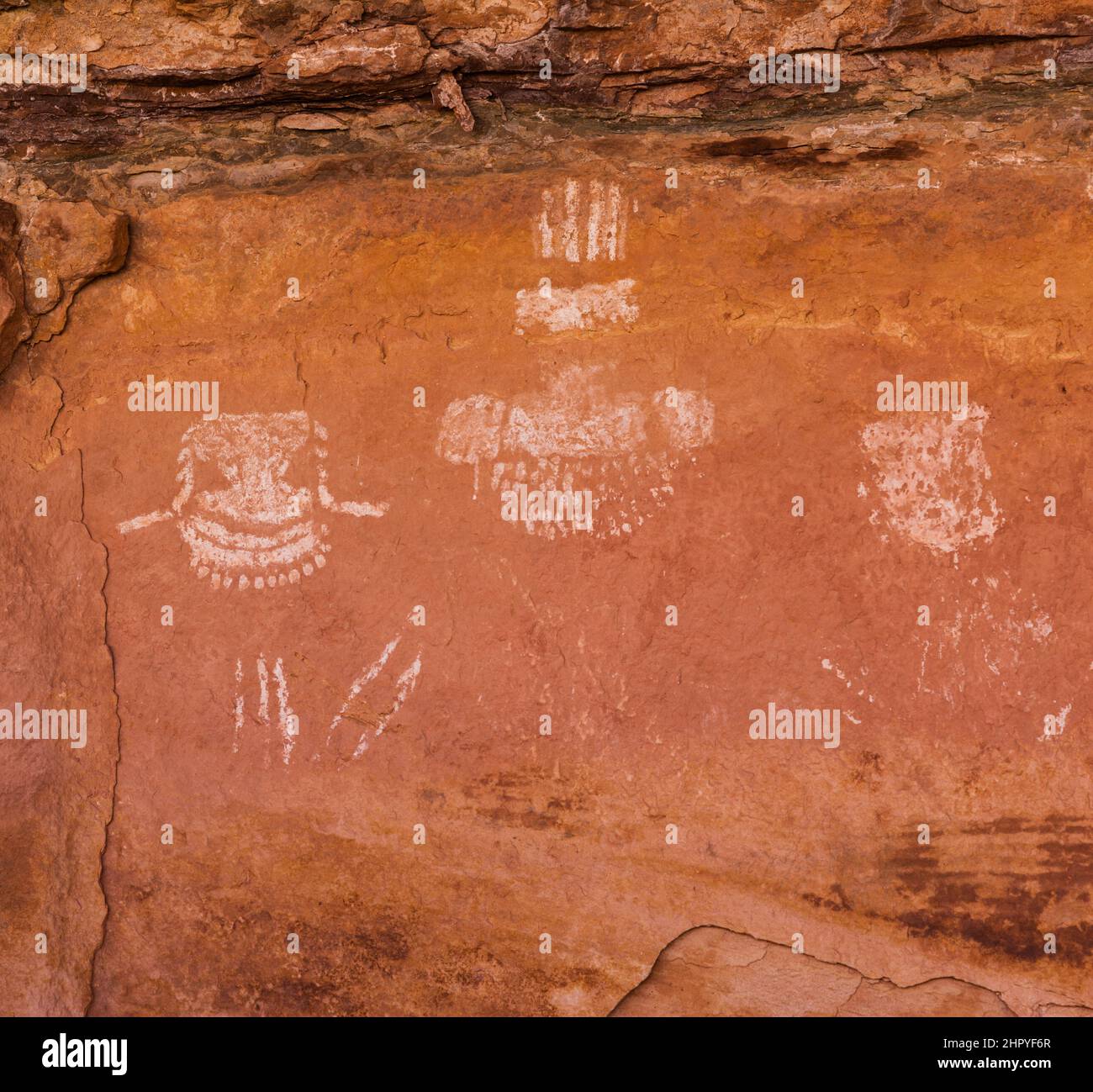 This ancient Native American rock art panel, called the Nine Faces, is ...