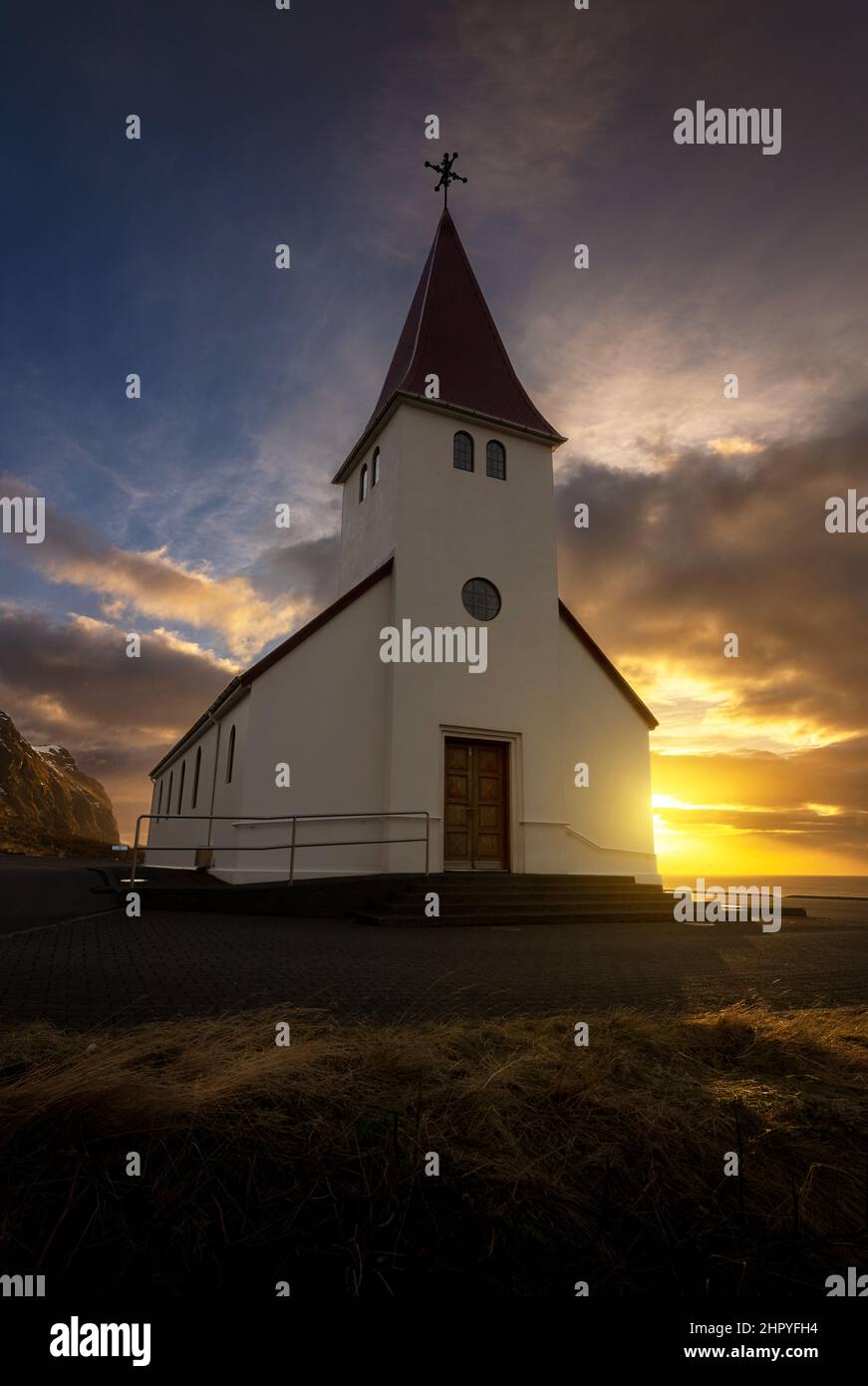 View of the famous icelandic church at sunrise in Vik y Myrdal, Iceland ...