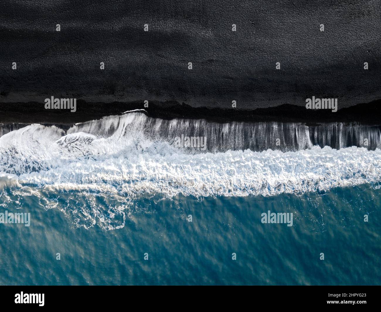 Scenic and abstract aerial view of the famous Reynisfjara black beach ... Scenic and abstract aerial view of the famous Reynisfjara black beach ...
