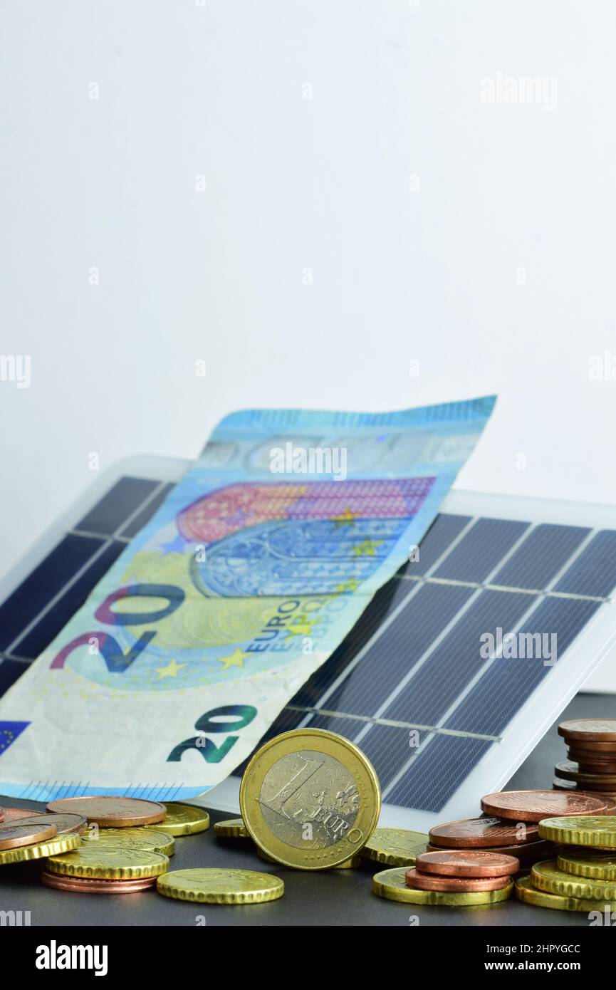 Small solar panel and scattered euros on white background Stock Photo ...