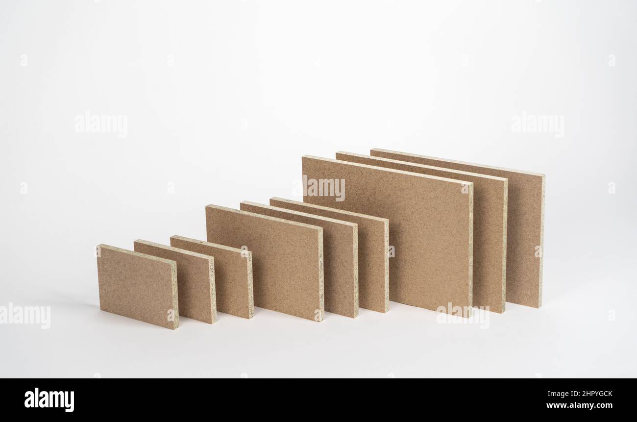 Chipboard building boards on a white background Stock Photo - Alamy