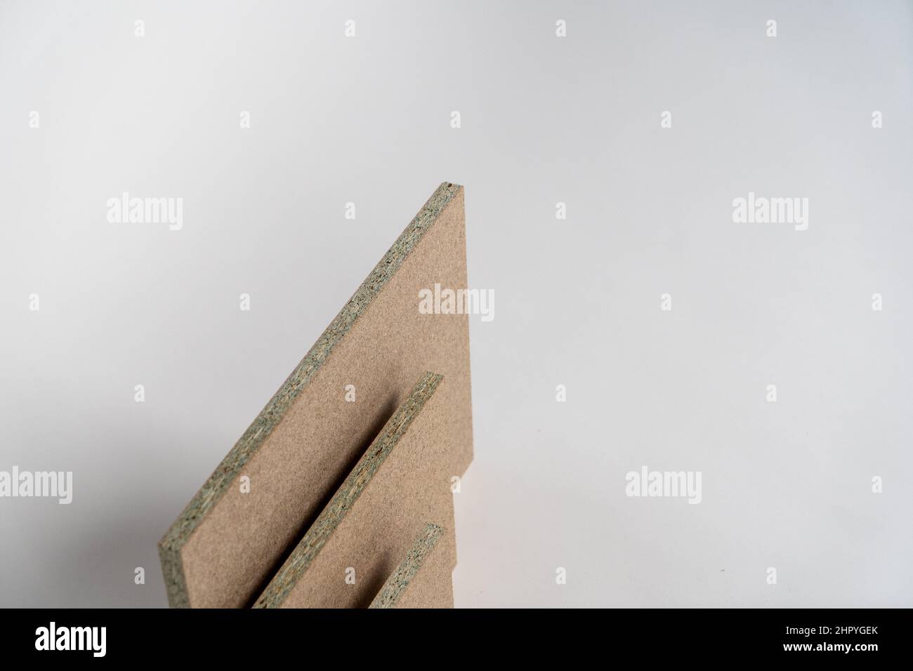 Chipboard building boards on a white background Stock Photo - Alamy