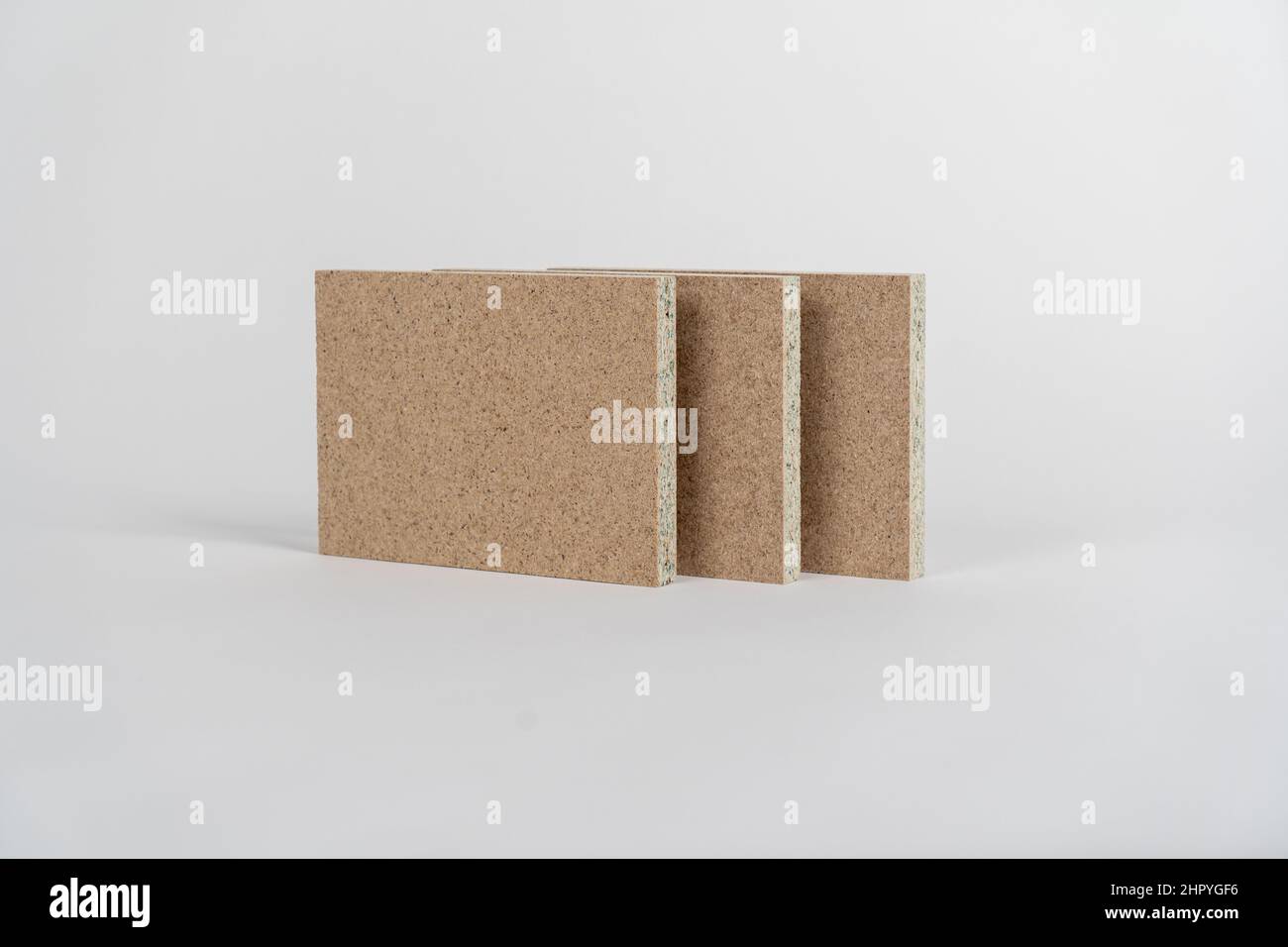 Chipboard building boards on a white background Stock Photo - Alamy