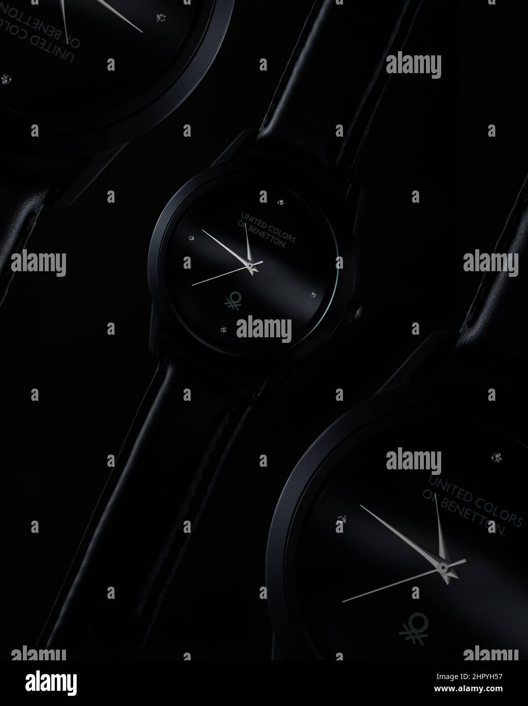Closeup of fancy elegant black watch with white Clockwise with a dark ...
