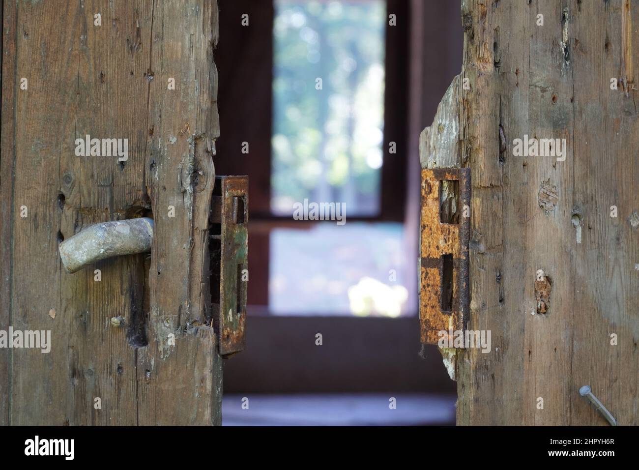 Soft focus of an ajar door of an old forgotten building at Konigswinter ...