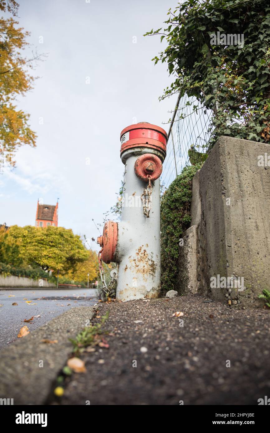 Vertical shot of a fire hydrant on the sidewalk Stock Photo - Alamy