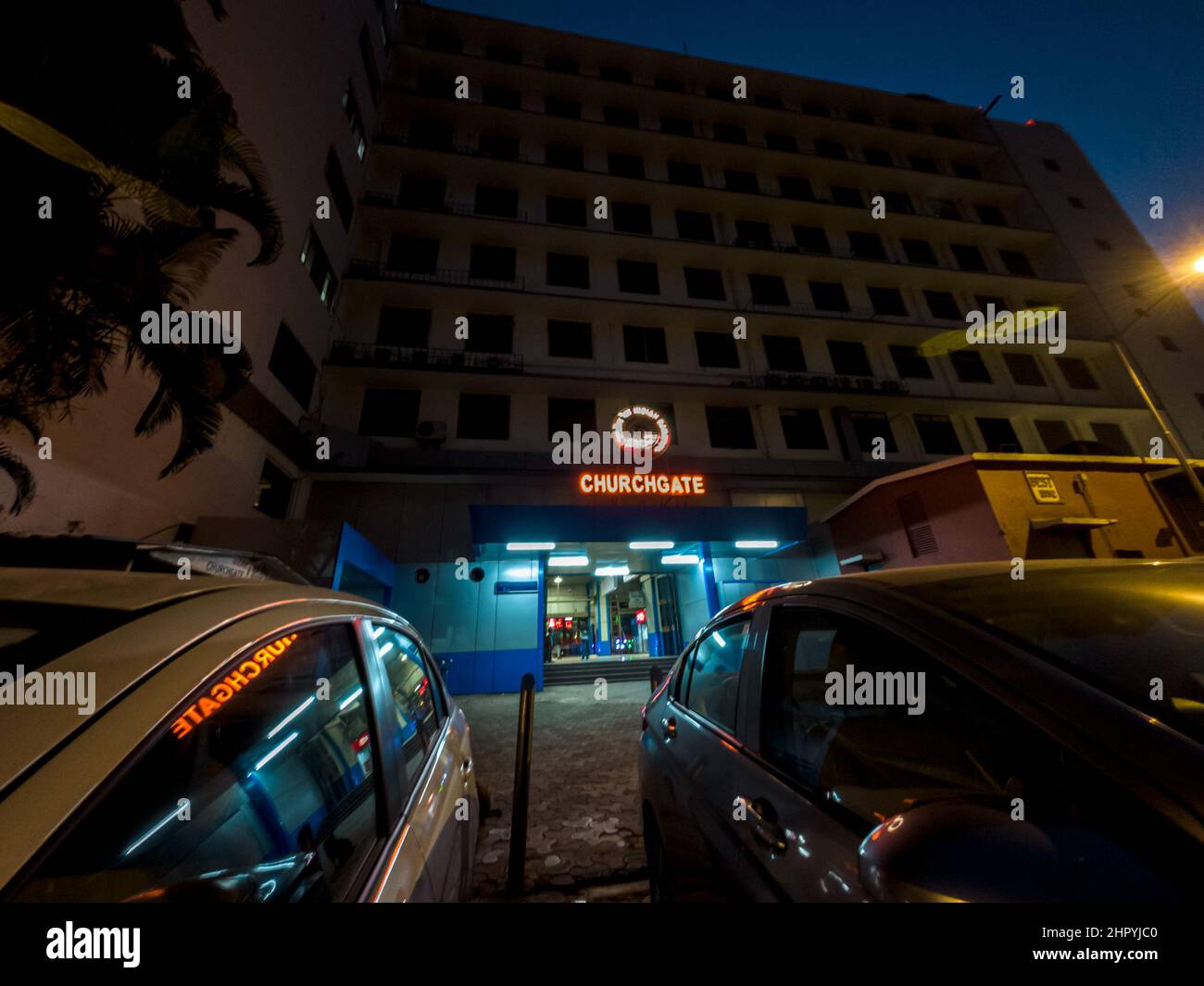 Low angle shot of the Churchgate old railways station at night. Mumbai ...
