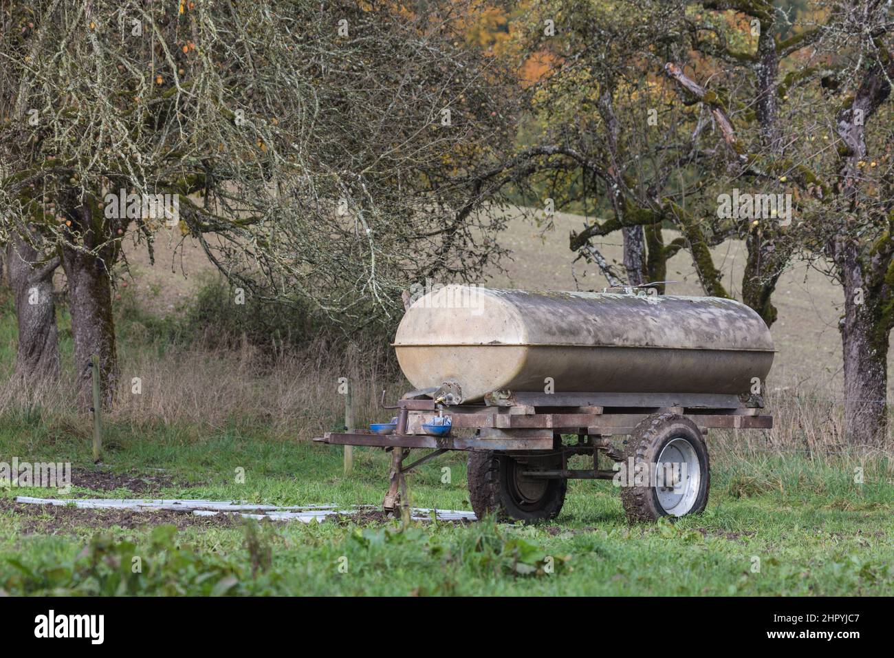 Old water tank on a trailer at a farm Stock Photo - Alamy