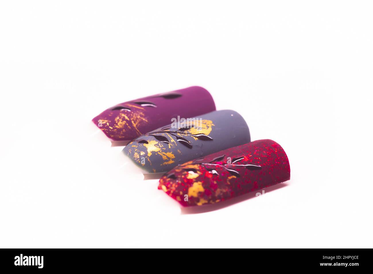 Colorful plastic matte nail designs on a white background Stock Photo ...