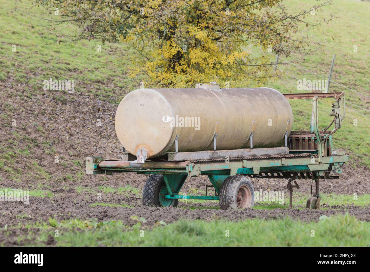 Old water tank on a trailer at a farm Stock Photo - Alamy