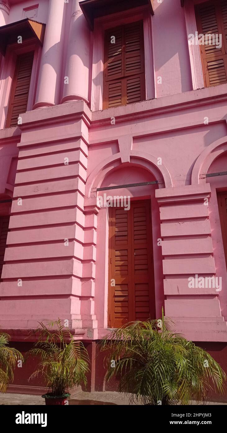 Vertical shot of an aesthetic pink building Stock Photo - Alamy