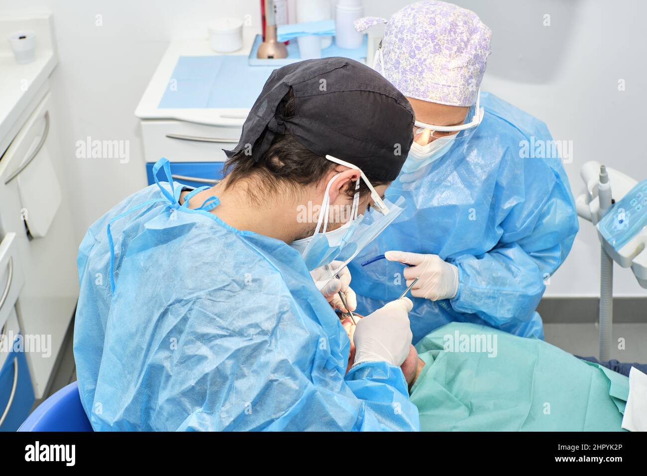 Patient during the dental medical intervention Stock Photo - Alamy