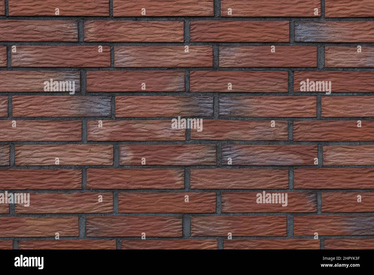 Closeup of a red brick wall pattern with black mortar joints Stock ...
