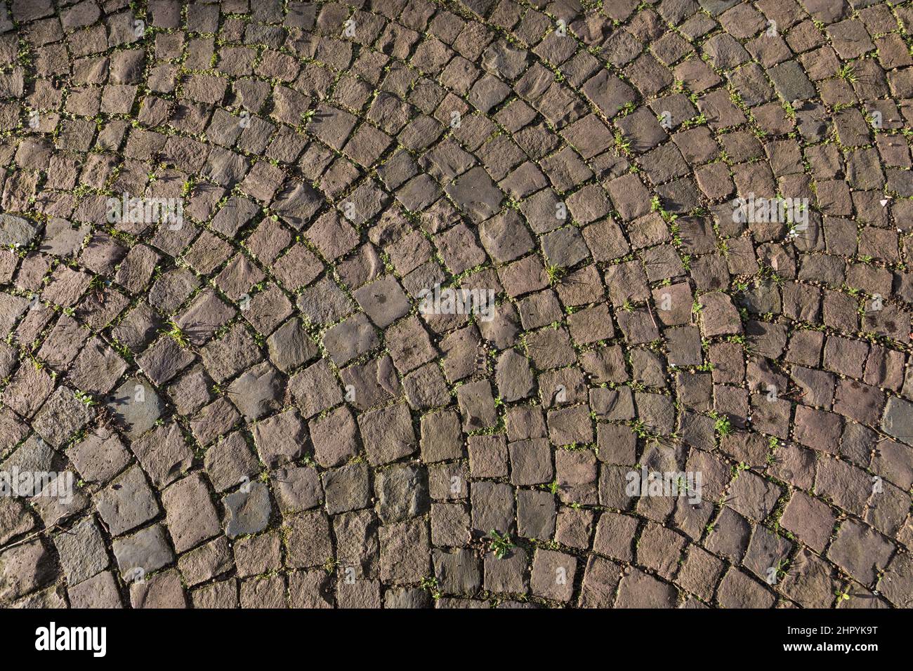 Overhead shot of arched cobblestone pavement Stock Photo - Alamy