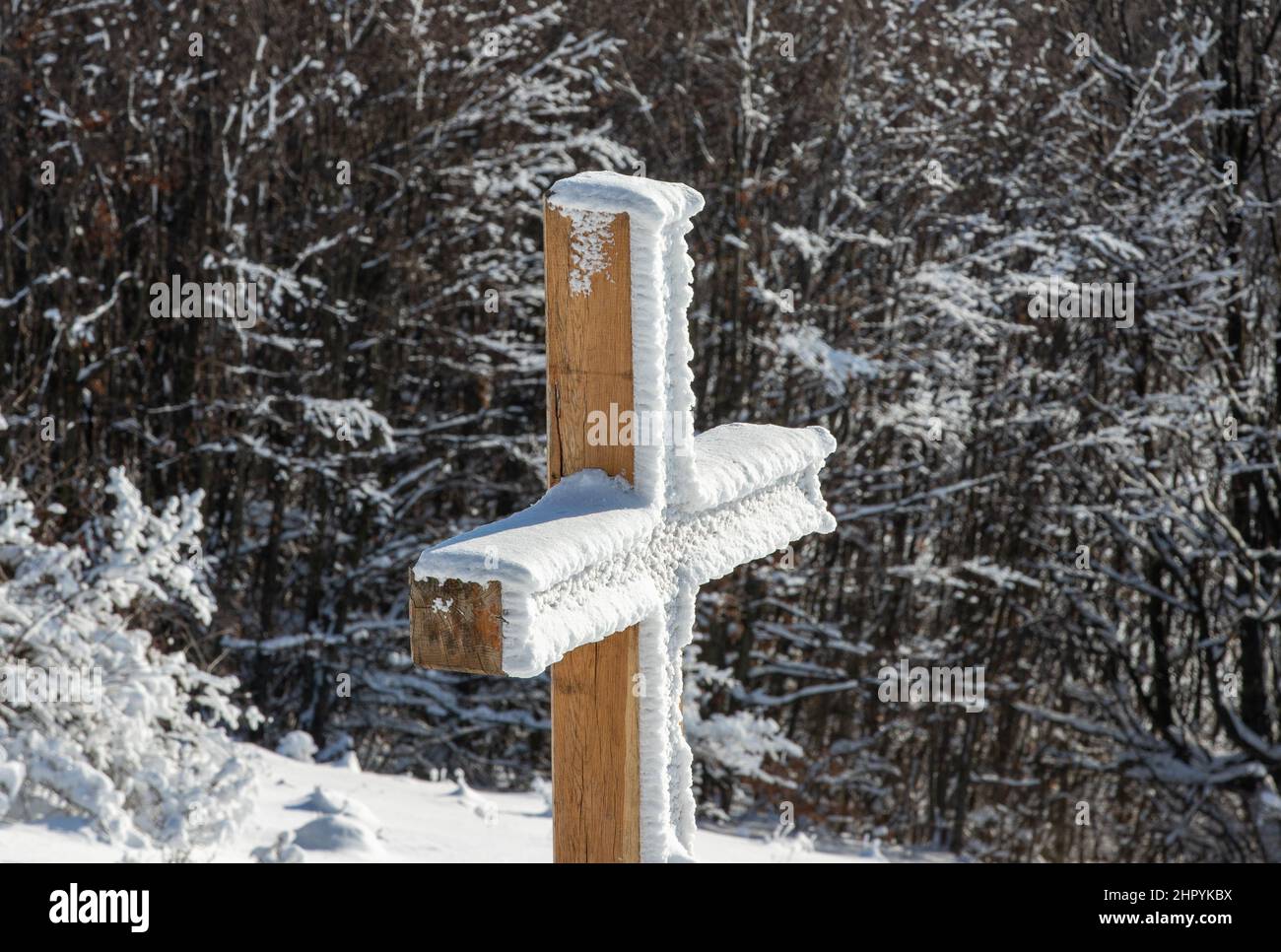 Wooden cross covered with snow Stock Photo - Alamy