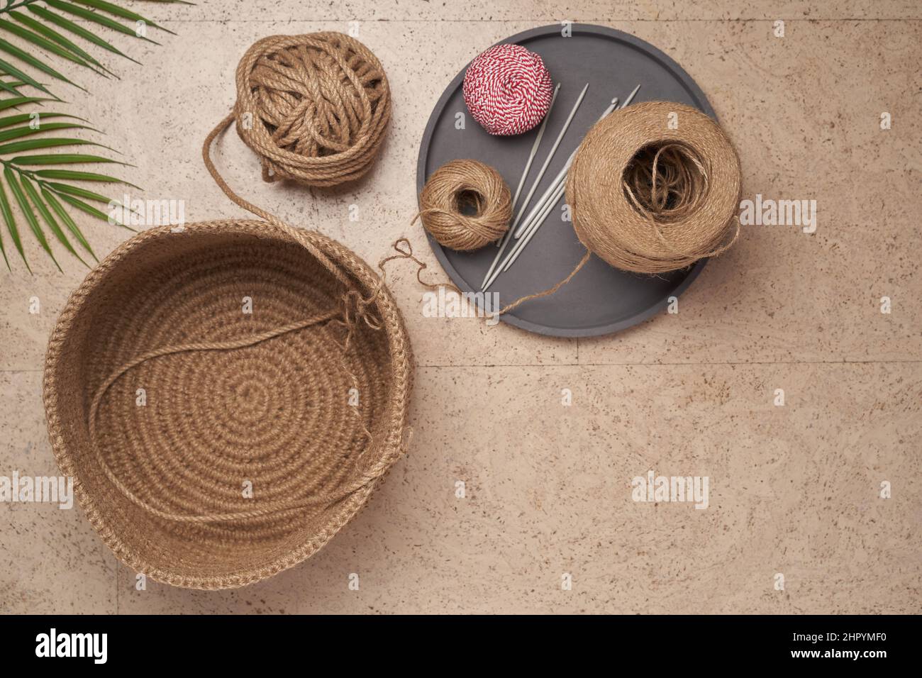 Jute crochet knitting bagger basket, tools and ropes. Flat lay hobby ...