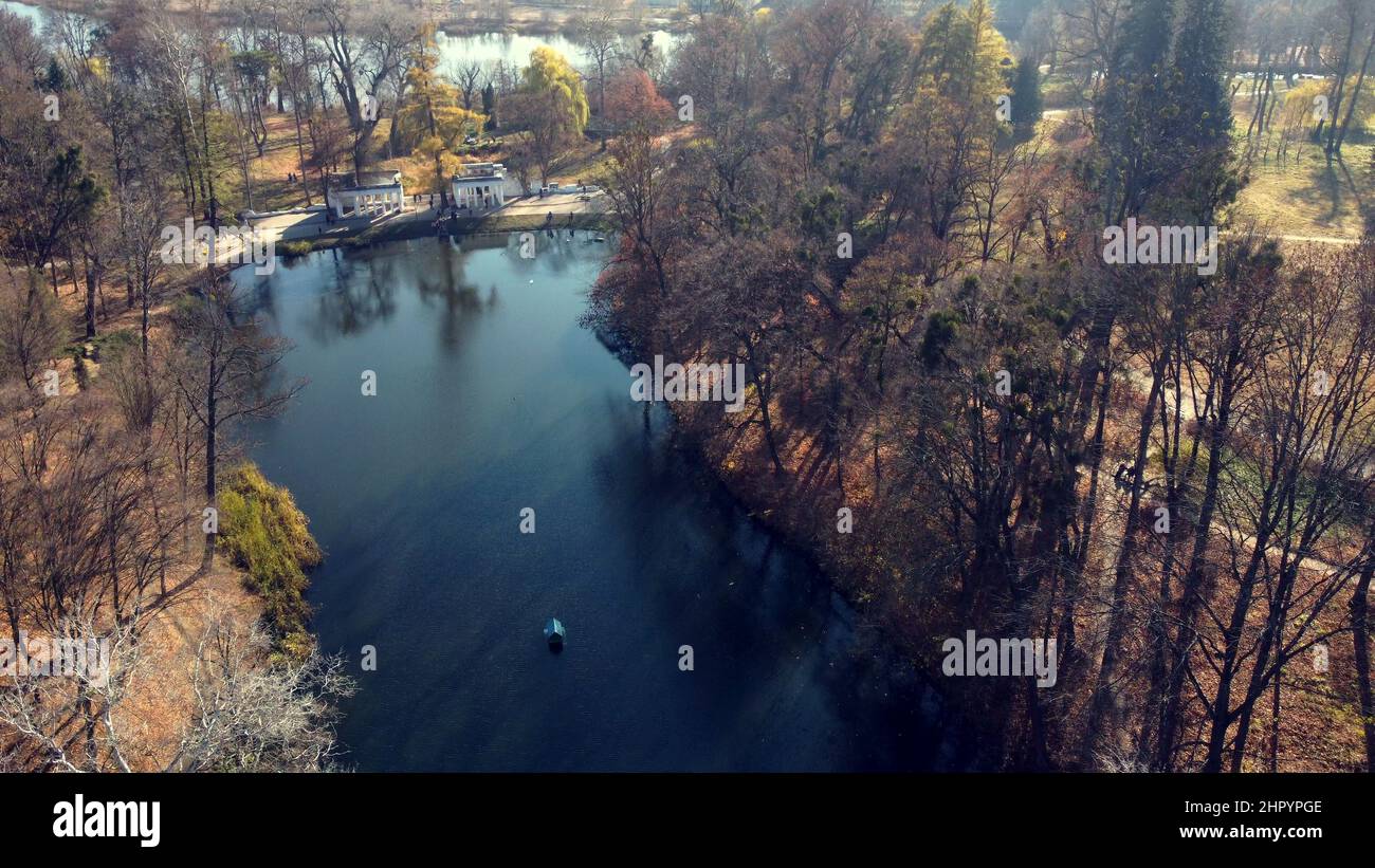 Arial drone view flight over lake in park on sunny autumn day Stock ...