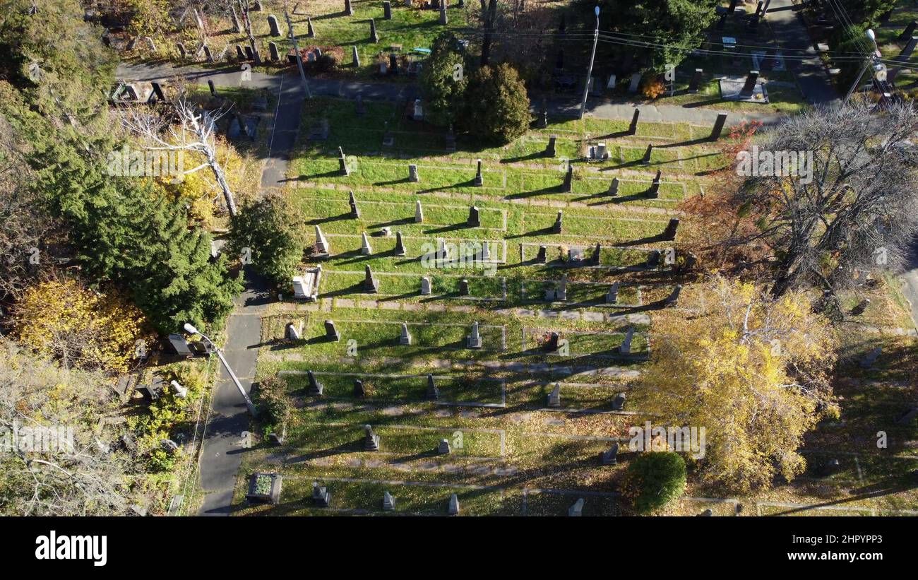 Arial drone view flight over old cemetery with tombstones, gravestones ...