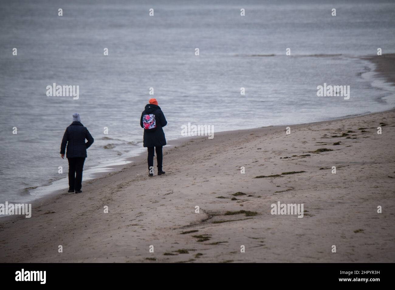Lubmin, Germany. 24th Feb, 2022. Walkers are out and about on the ...