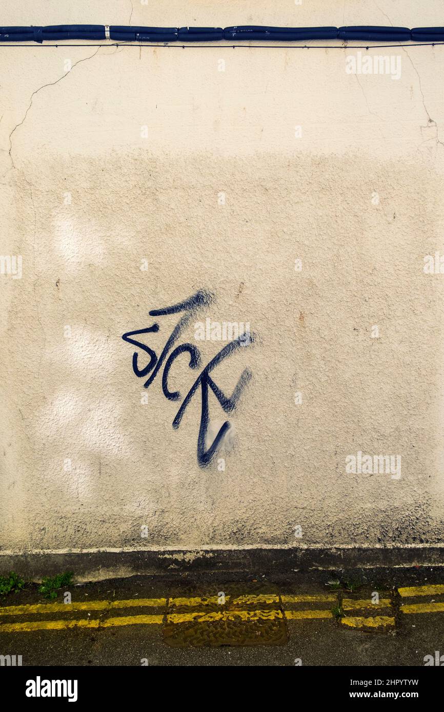 Ugly graffiti sprayed on a wall in Newquay Town centre in Cornwall ...