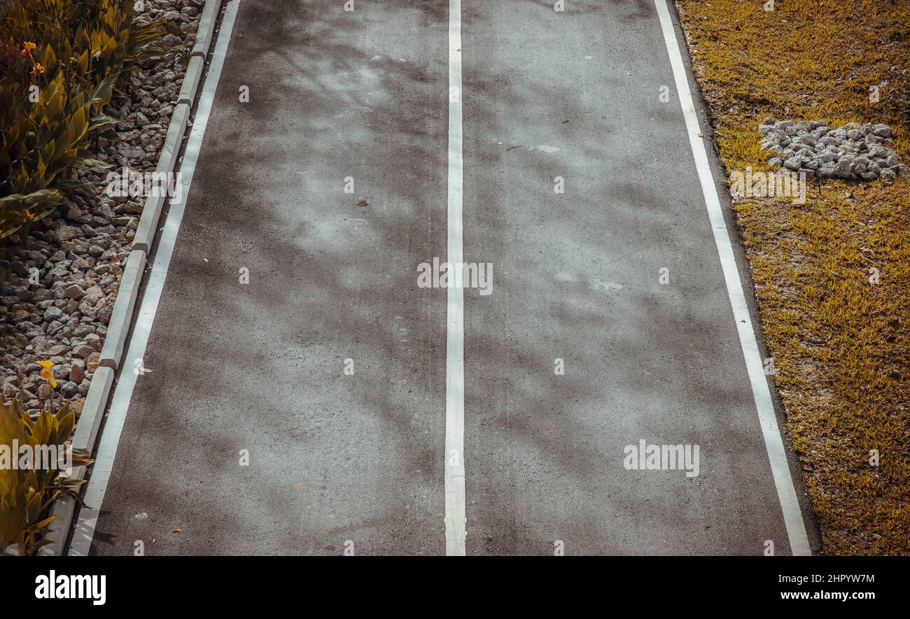 Top view of empty road texture with straight lines in white line on ...