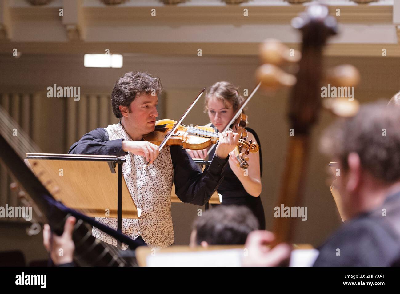 Violinist, Adrian Chandler rehearsing with the ensembles La Serenissima ...
