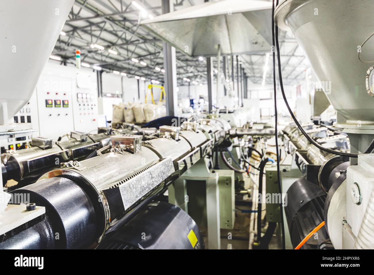 Workshop with extruders for producing plastic pipes. High speed ...