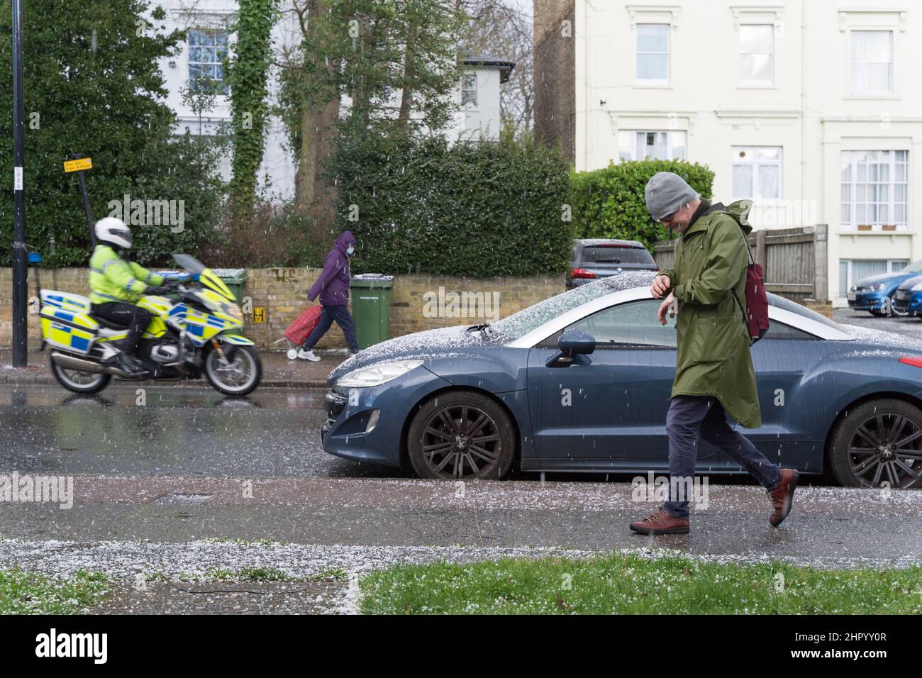 London UK 24 February 2022 . UK weather. Sudden rain, hail storm, sleet ...