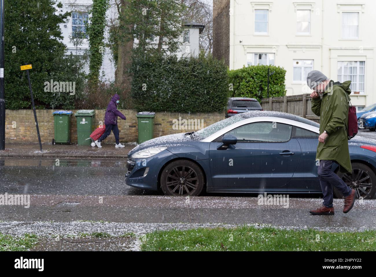 Man caught in the hail and rain hi-res stock photography and images - Alamy