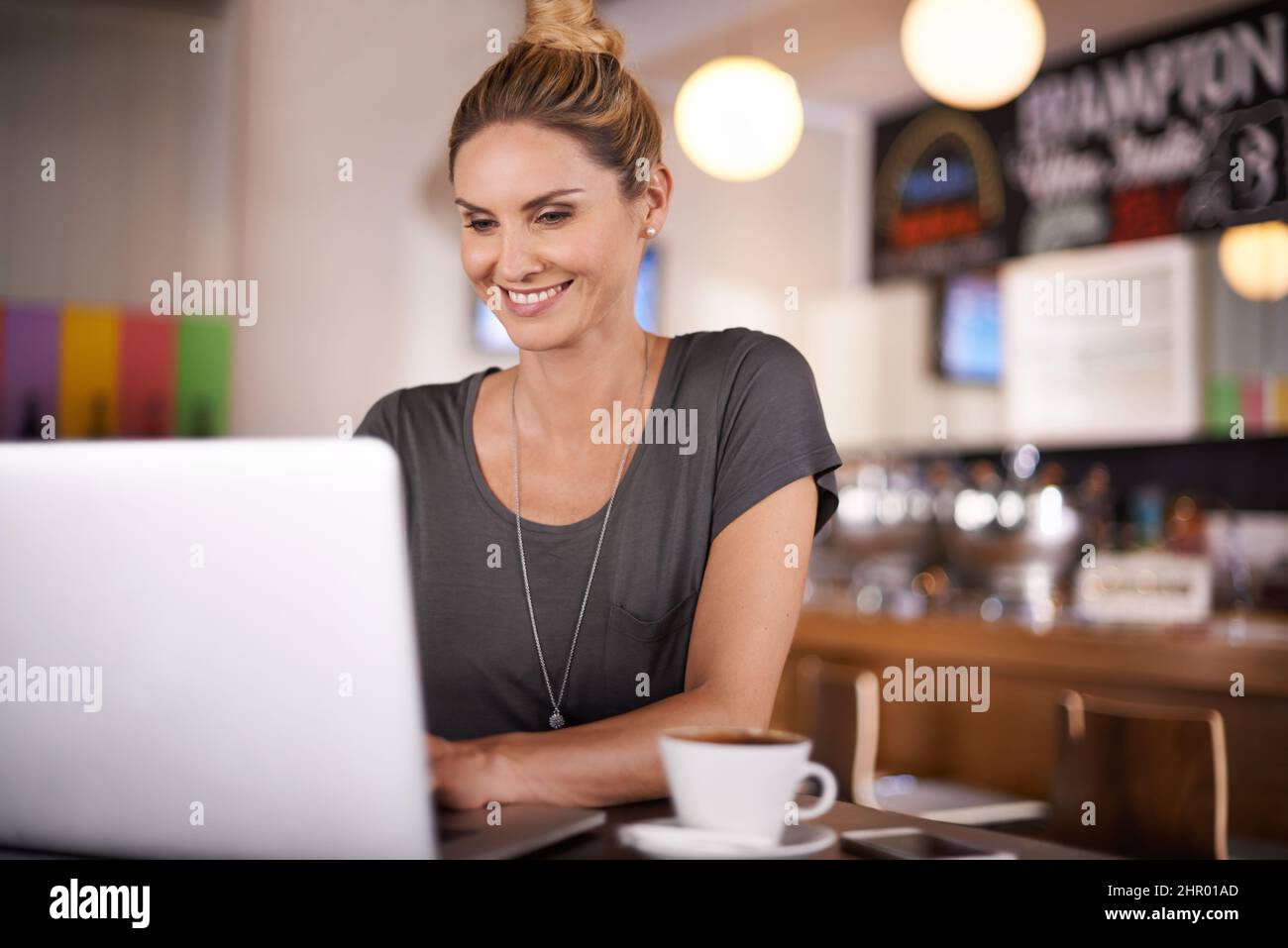 Shes a woman in touch with technology. A beautiful woman using her ...