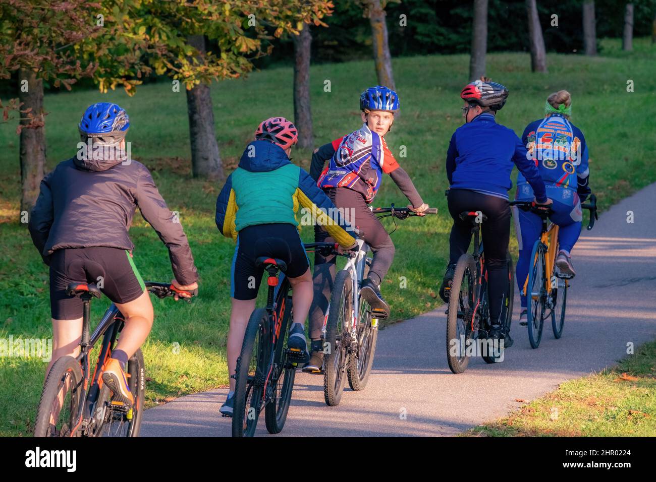A group of young cyclists in training. One of them turned towards the ...
