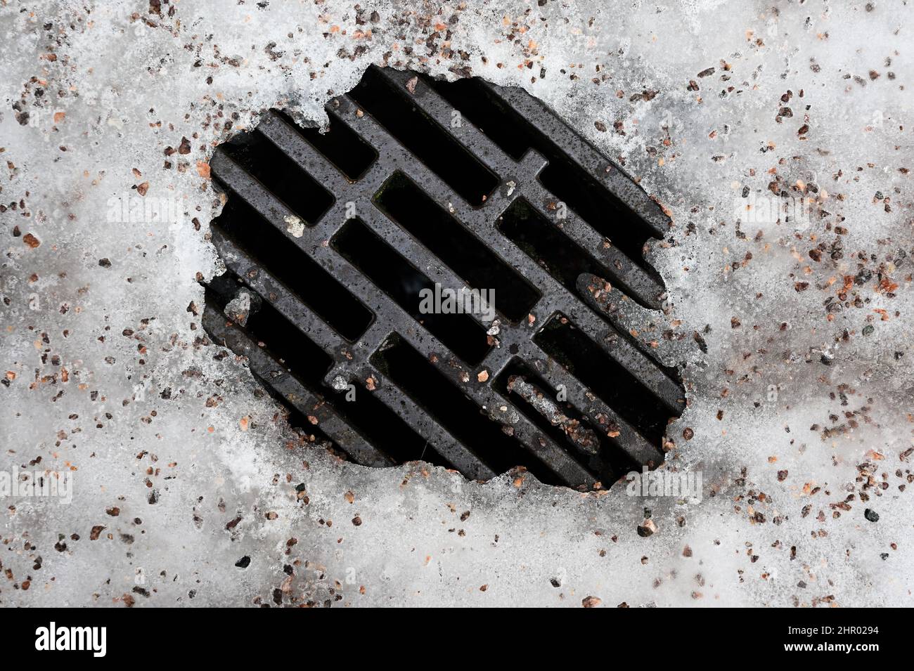 storm sewer manhole with ice in winter Stock Photo - Alamy