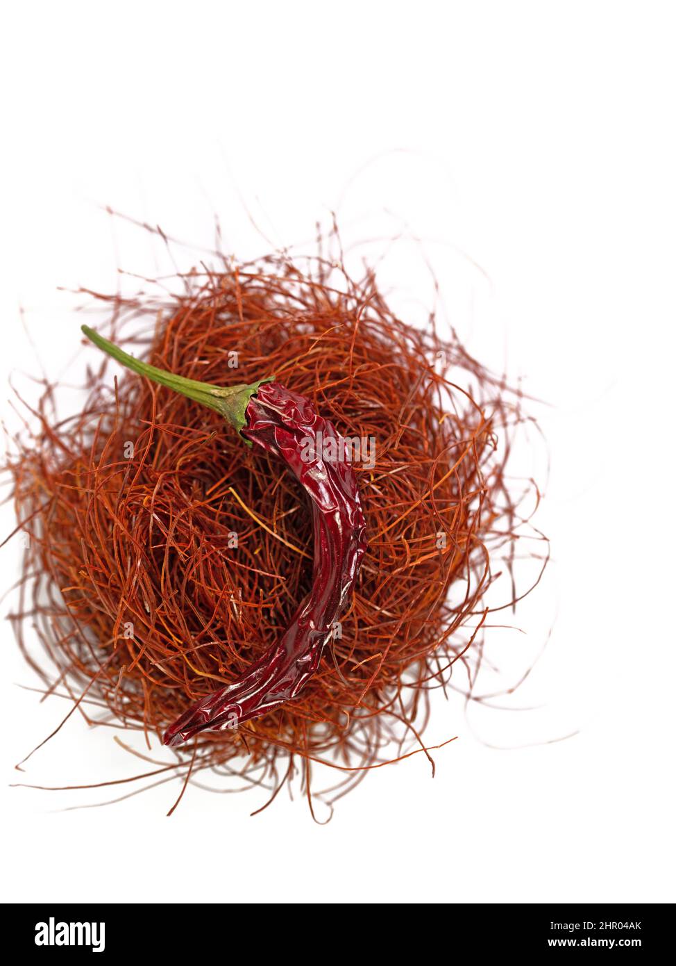 Chilli threads and chilli pod against white background Stock Photo - Alamy