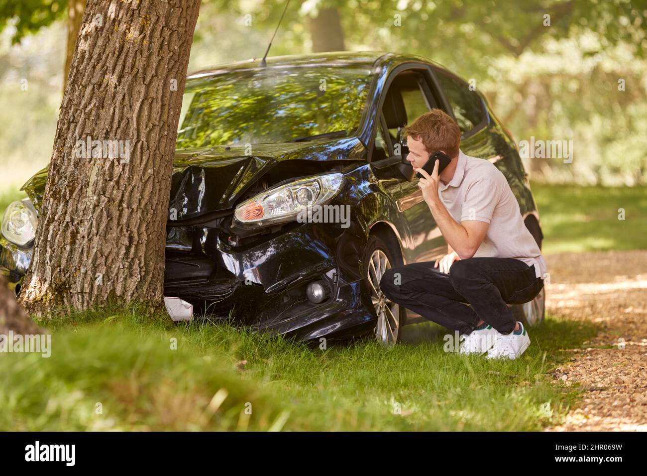 Man Next To Car Crashed Into Tree Inspecting Accident Damage And ...