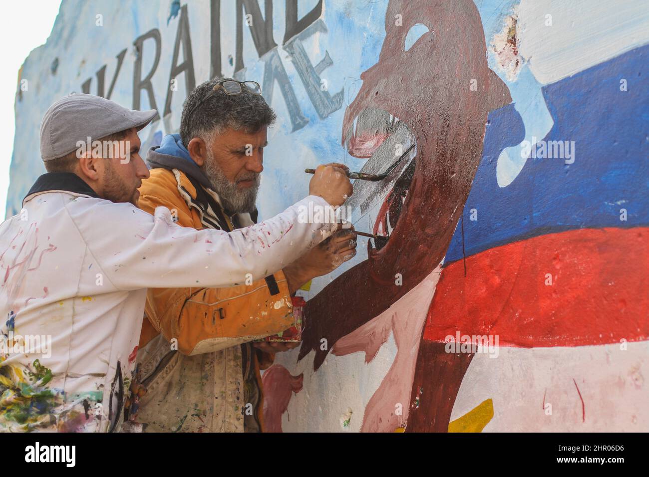 February 24, 2022: Graffiti Aziz Al-Asmar and Anis Hamdoun draw a ...