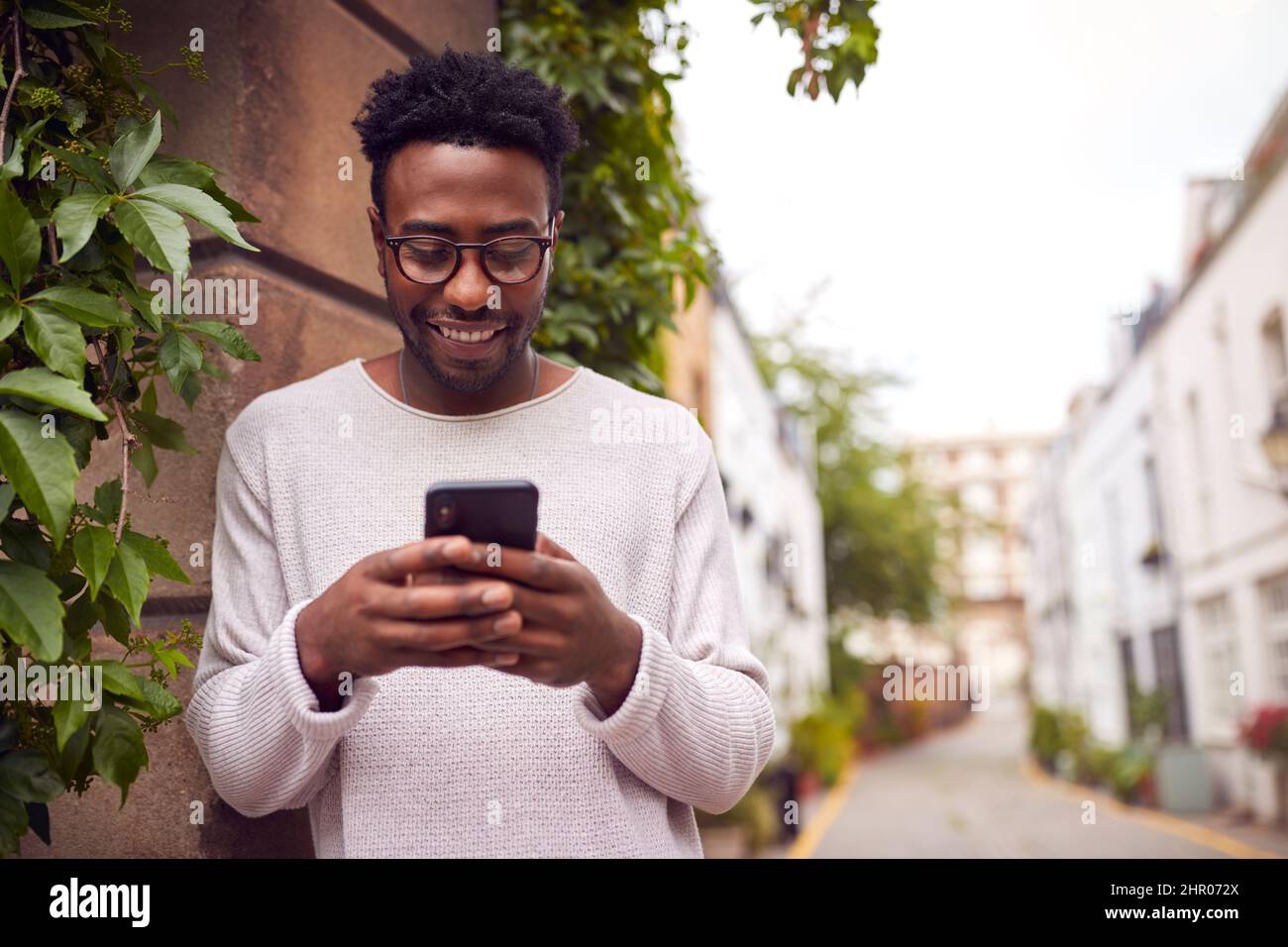 Male Vlogger Or Social Influencer In City Using Mobile Phone On Street ...