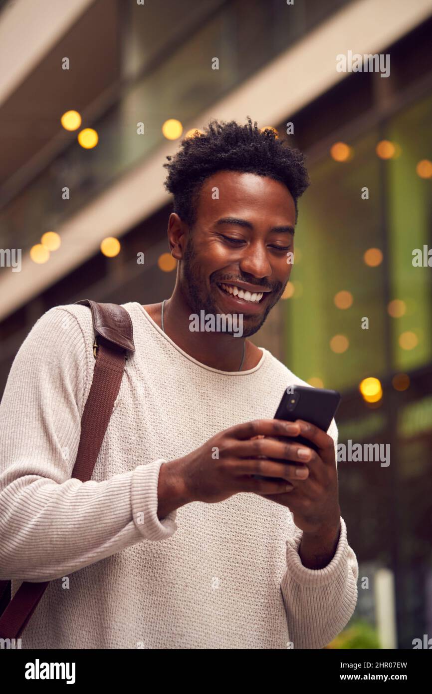 Male Vlogger Or Social Influencer In City Using Mobile Phone On Street ...