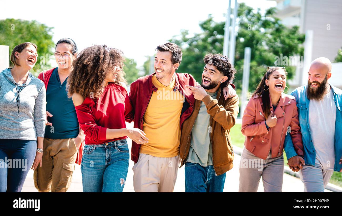 Multicultural friends walking together at summer location - Happy guys ...