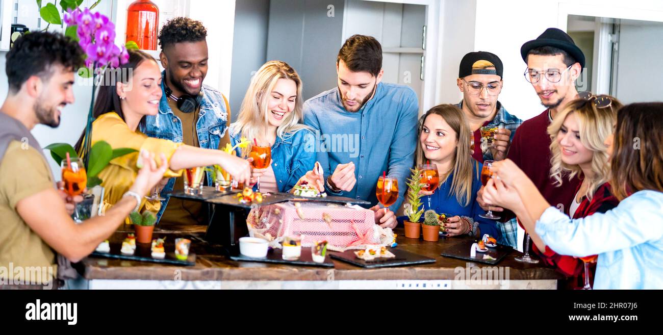 Friends group having fun at pre dinner party buffet drinking fancy ...