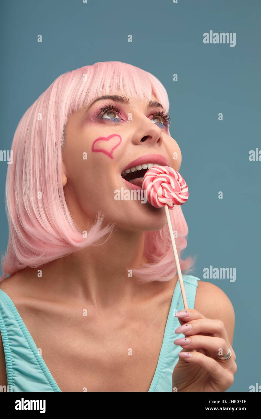 Candy Lolli pop Party Girl posing in white studio. Role-playing games ...