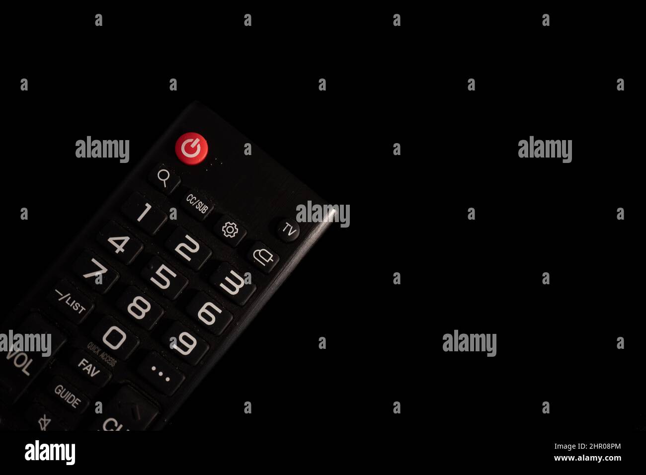 TV power button on the remote control on black background Stock Photo ...