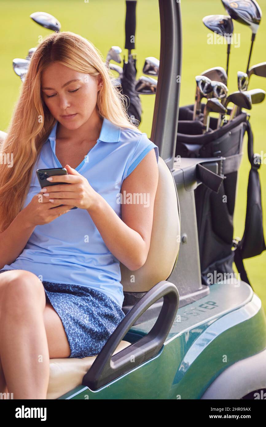 Female golfer sitting in golf hi-res stock photography and images - Alamy
