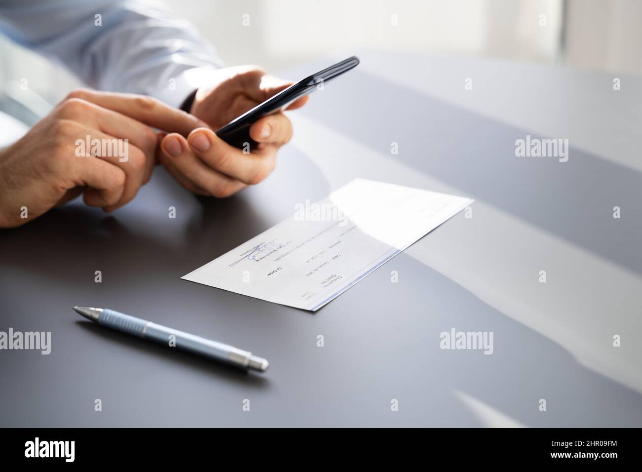 Remote Check Deposit Taking Photo With Mobile Phone Stock Photo - Alamy