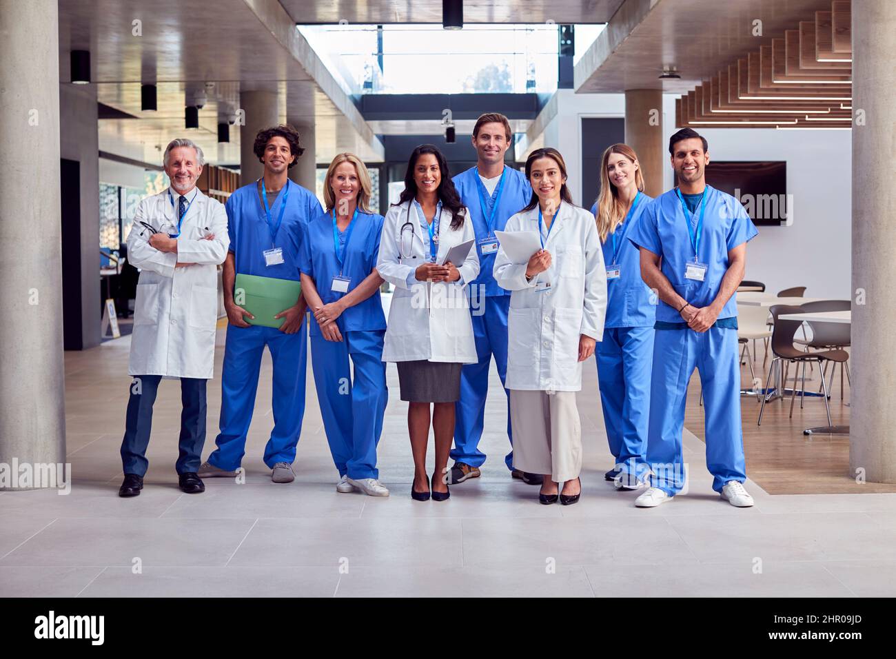 Portrait Of Multi-Cultural Medical Team Wearing Uniform Standing Inside ...