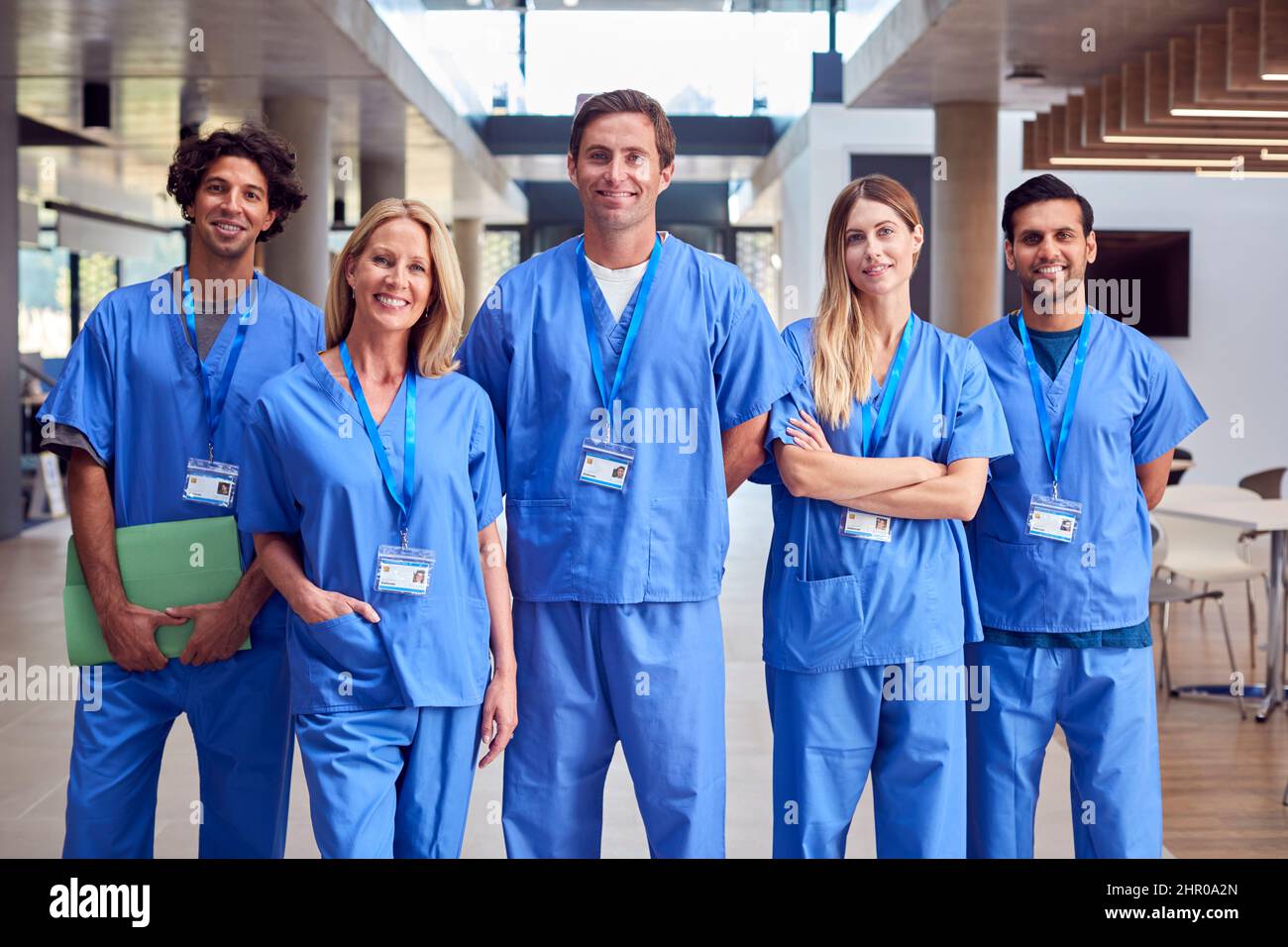 Portrait Of Multi-Cultural Medical Team Wearing Scrubs Standing Inside ...
