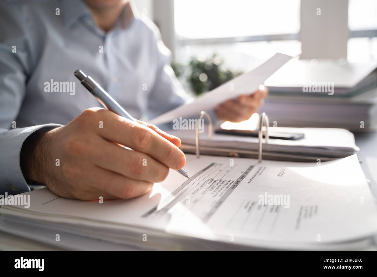 Public Tax Accountant Checking Invoice. Finance Ledger Stock Photo - Alamy